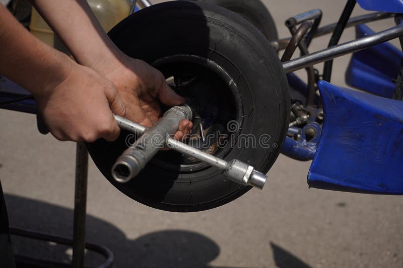 Changing a Wheel on a Racing Car Stock Photo - Image of change, chrome ...