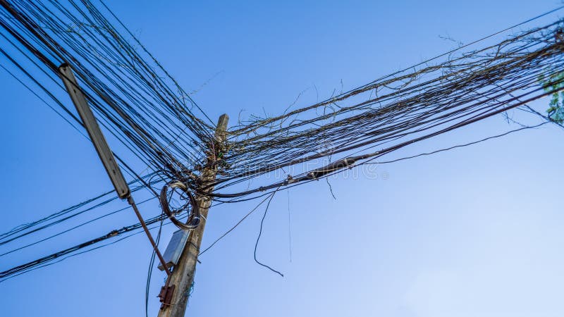 Chaos Electric Feed and Wire on the Pole with Telecommunication Stock ...