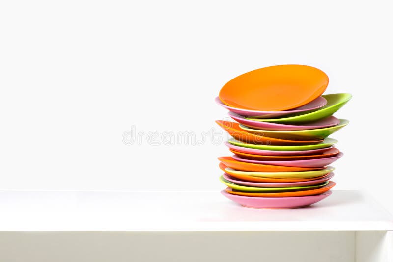 The Chaotically Pile of Color Plates on a Table Stock Photo - Image of ...