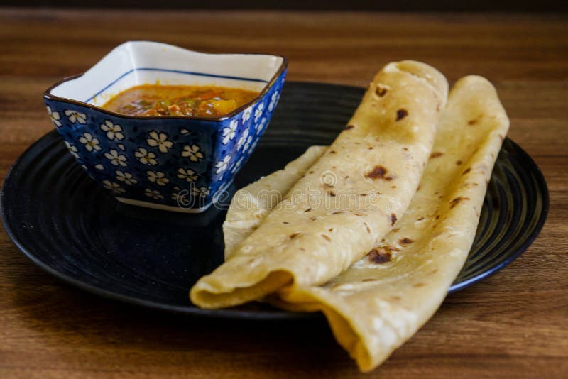 Chapati with Chicken Curry Mix with Sardine Sambal Stock Image - Image ...
