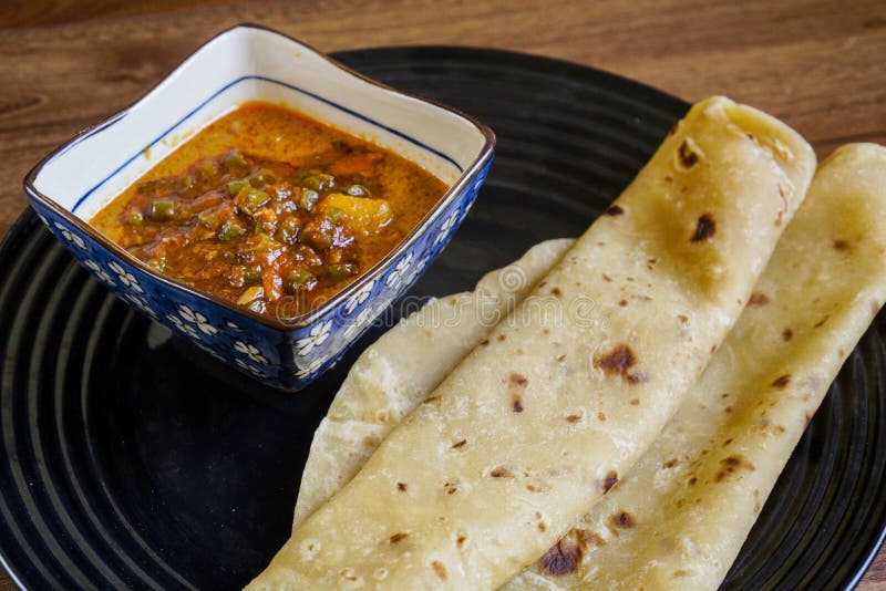 Chapati with Chicken Curry Mix with Sardine Sambal Stock Photo - Image ...