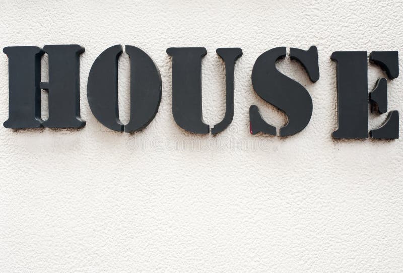 Characters of HOUSE Written on the White Wall Stock Image - Image of ...