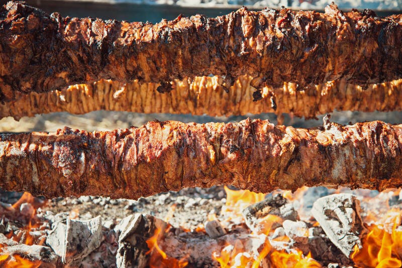 Charcoal BBQ Spit Roast Meat Stock Photo - Image of event, cooking ...