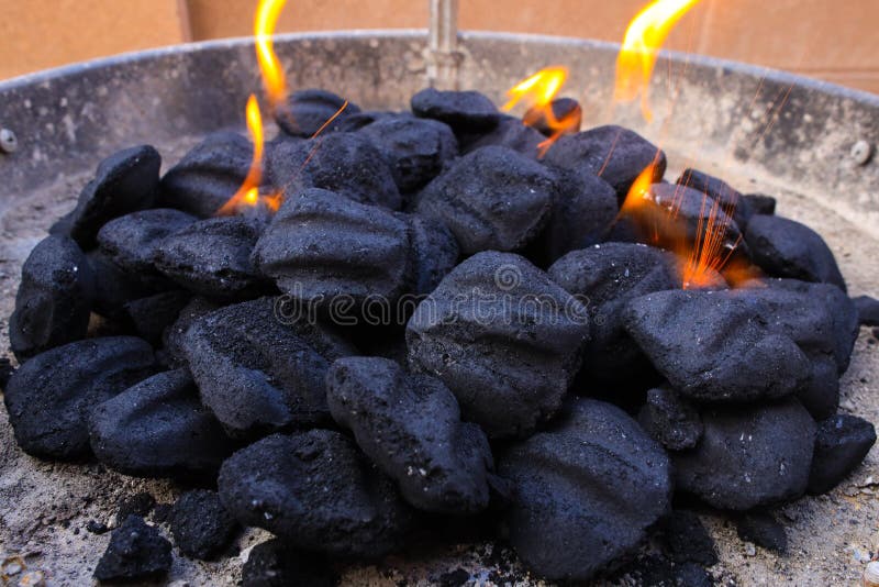 Charcoal bricks sparking stock image. Image of fire - 186895407