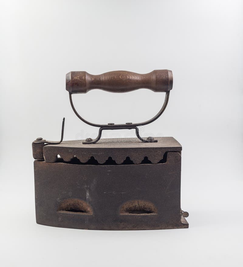 Old Ironing Iron of the Past Centuries in a Man`s Hand. Stock Photo ...