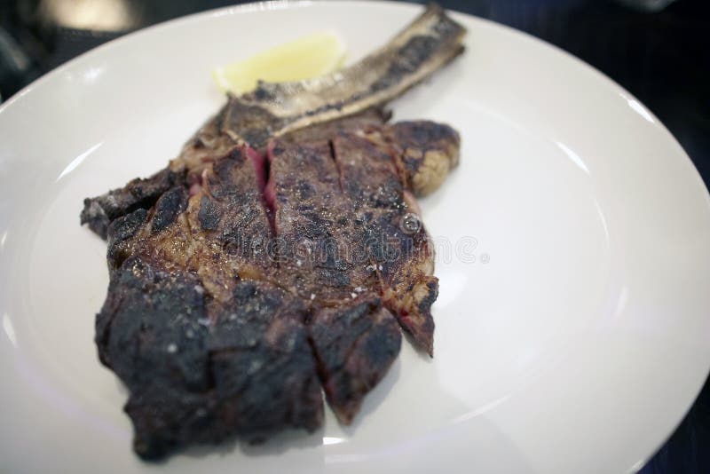Charcoaled Dry Aged Rib-eye on the Bone Stock Image - Image of fatty ...
