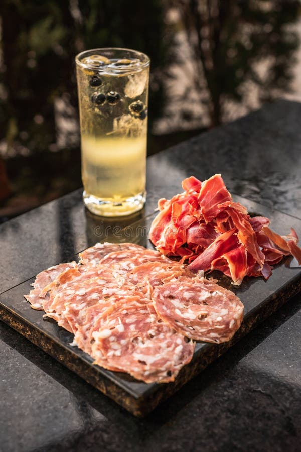 Charcuterie Board of Hams Along with an Alcoholic Drink Based on ...