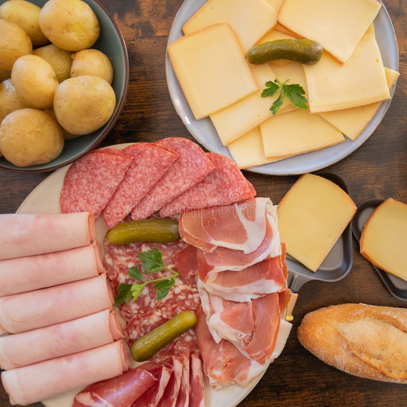 Charcuterie in a Dish with Raclette Cheese Stock Image - Image of ...