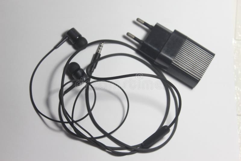 Charger head and earphones stock photo. Image of head - 254952414