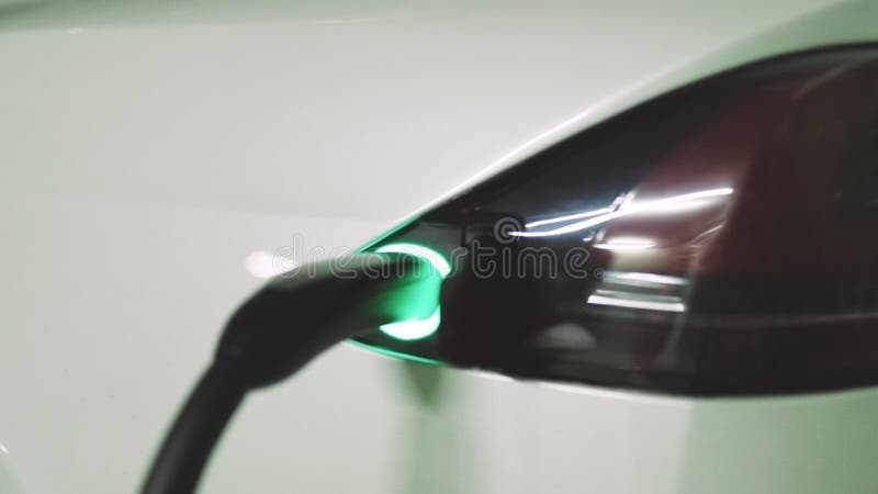 Electric Vehicle Charging Port Plugging in EV Modern Car. Modern ...