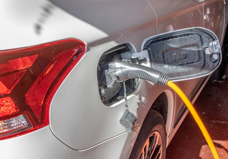 Electric Plugin Hybrid Car and Socket Stock Photo - Image of hybrid ...