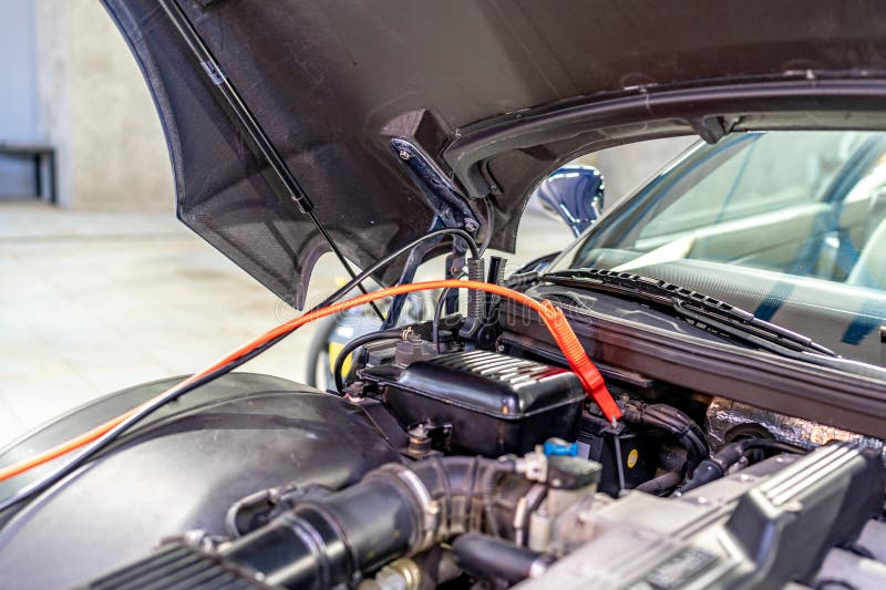 Charging the Car Battery Using Electric Cables Stock Photo - Image of ...