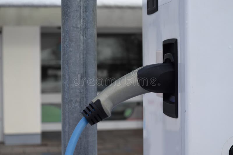 Charging an Electric Car at a Charging Station Stock Photo - Image of ...