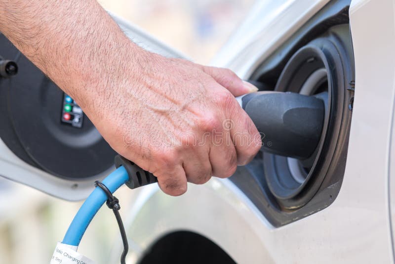 Charging an Electric Vehicle Stock Photo - Image of line, chargeable ...