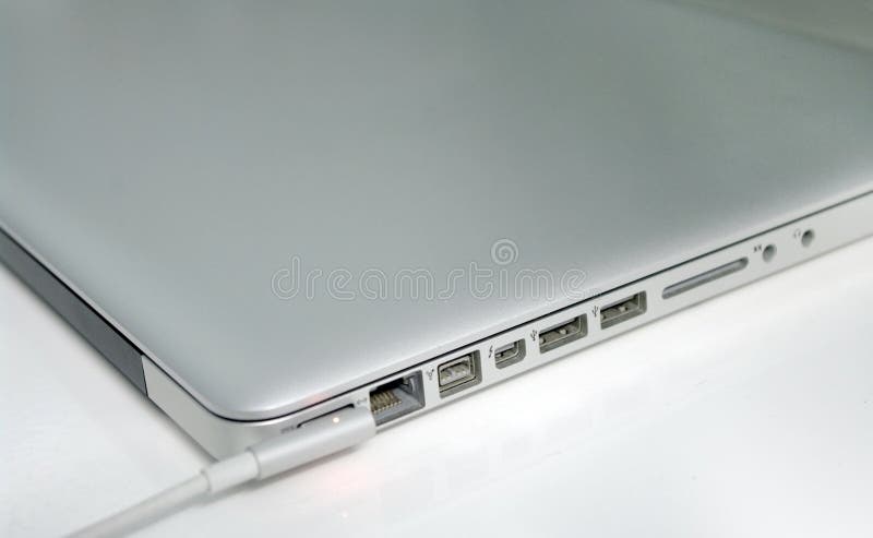 Charging laptop stock photo. Image of magnetic, table - 33297742