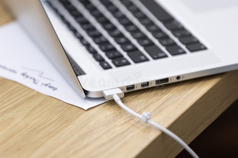 Charging Laptop on Wooden Desk - Work from Home Setup or Office ...