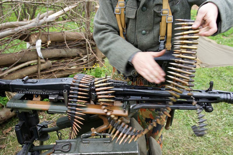 Charging of a machine gun. stock image. Image of charging - 128904063