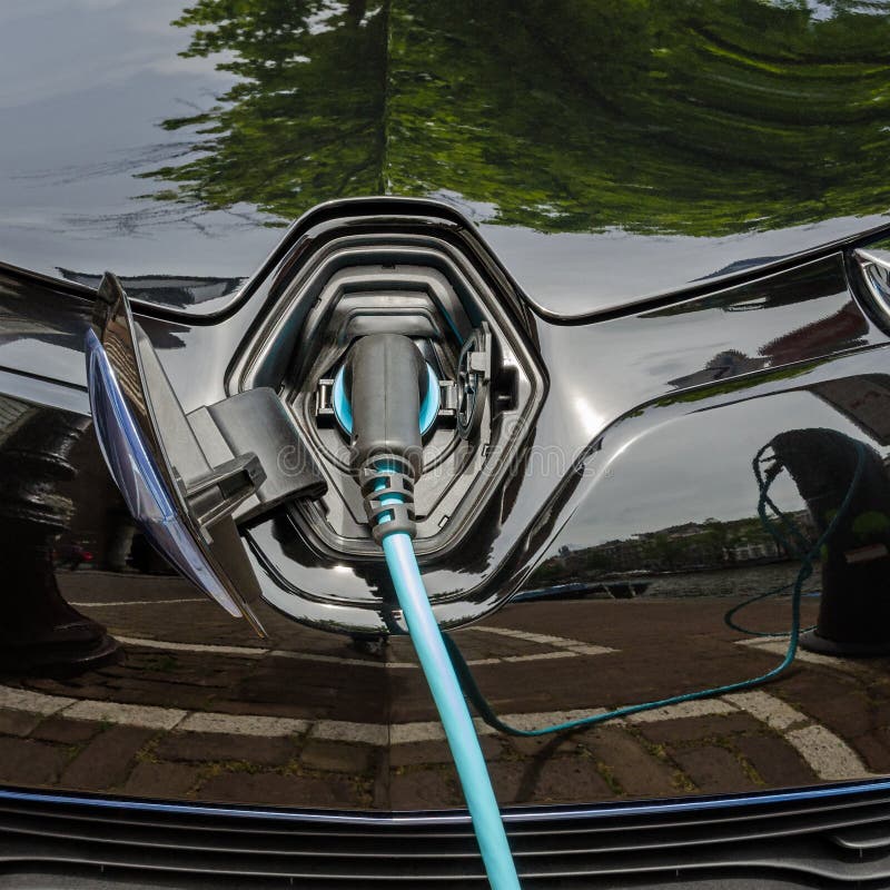 Charging Modern Electric Car with Power Supply Plugged in Stock Image ...