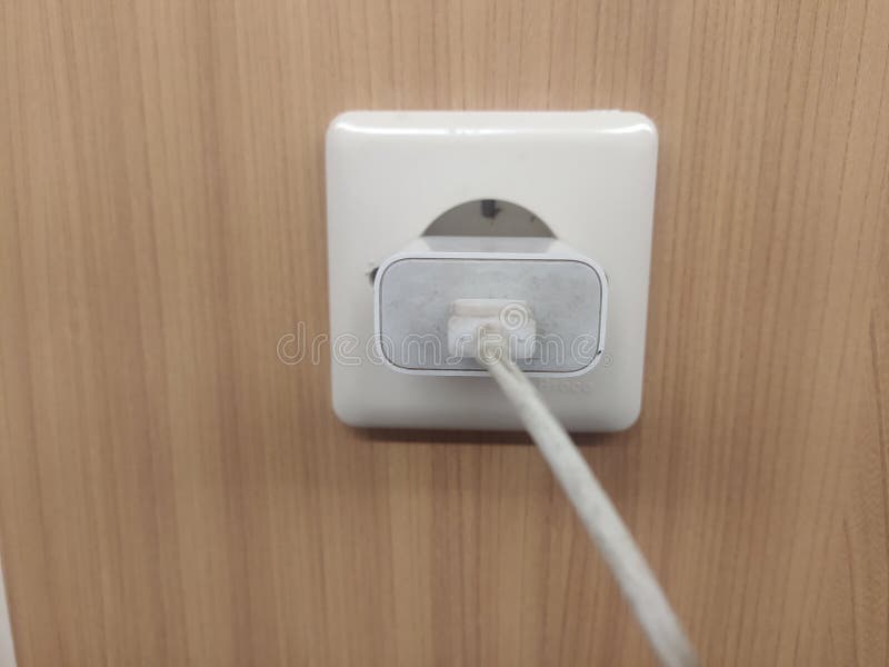 Charging by Plugging into Electricity Stock Image - Image of room ...