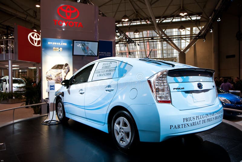 Charging a Toyota Prius at the Auto Show Editorial Image - Image of ...