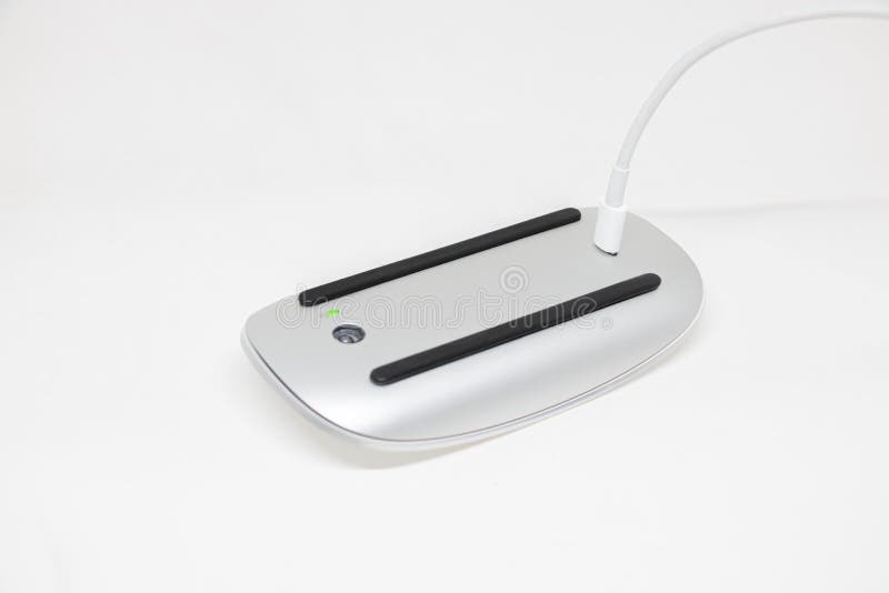 Charging a wireless mouse stock image. Image of cable - 148093449