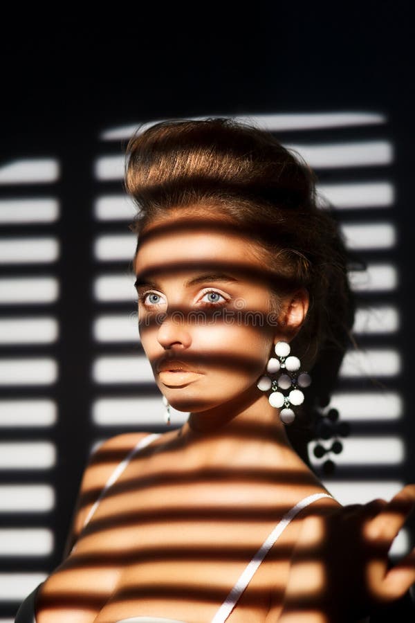 Charisma. Charming Woman S Face in Shadow of Roller Blind Stock Photo ...