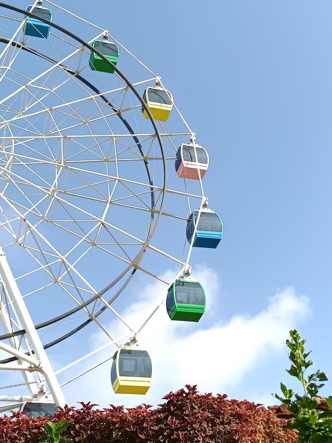 The Charm of a Festival with a Grand Ferris Wheel Stock Photo - Image ... The Charm of a Festival with a Grand Ferris Wheel Stock Photo - Image ...