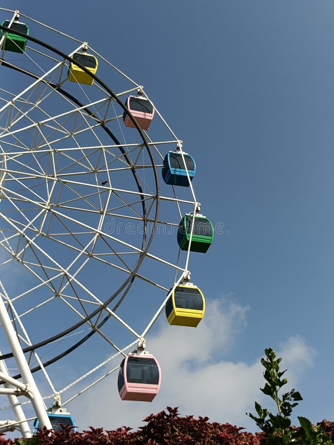 The Charm of a Festival with a Grand Ferris Wheel Stock Image - Image ... The Charm of a Festival with a Grand Ferris Wheel Stock Image - Image ...