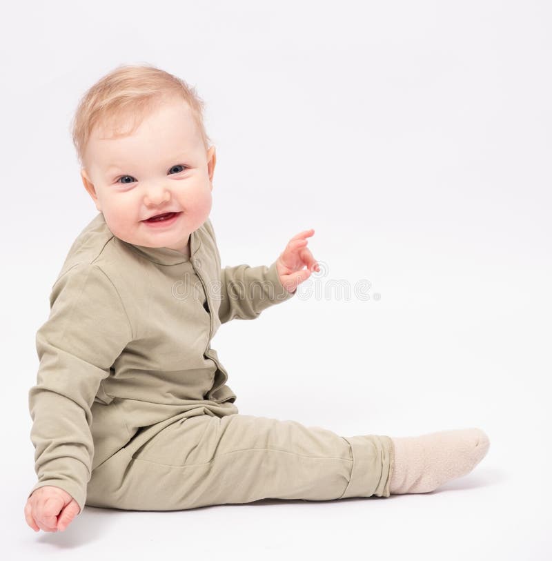 Charming Baby Sits on the Floor and Smiles Stock Photo - Image of small ...
