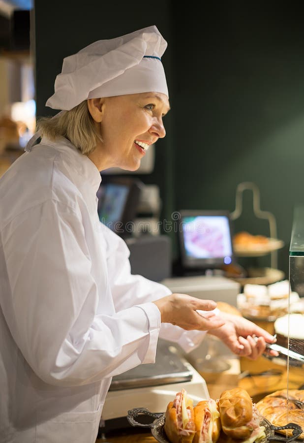Charming Bakery Staff Sells Bread and Different Pastry for Sale Stock ...