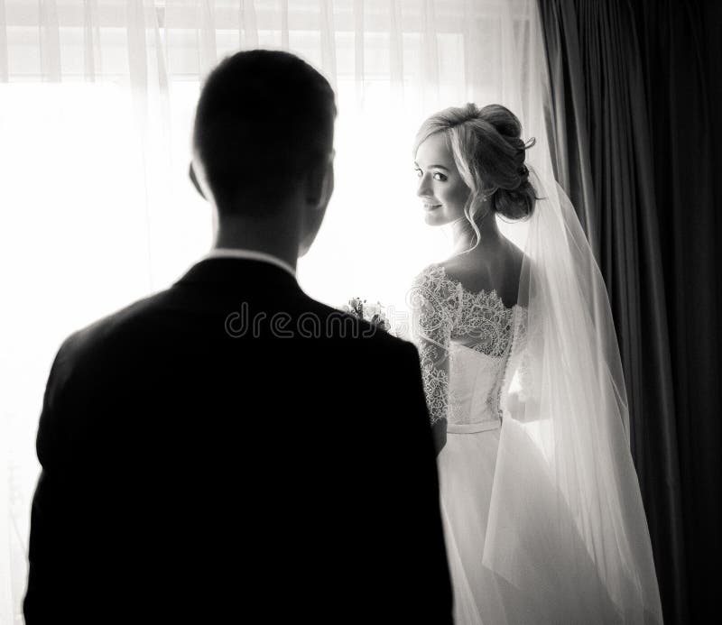 Charming Blonde Bride Looks Over Her Shoulder at Groom Stock Photo ...