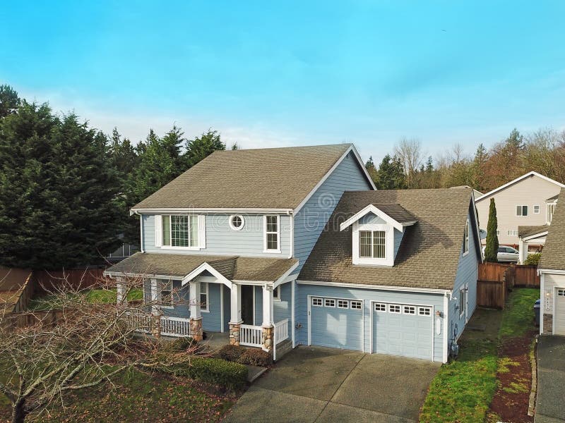 Charming Blue Two Story Home with a Nice Covered Porch. Stock Photo ...