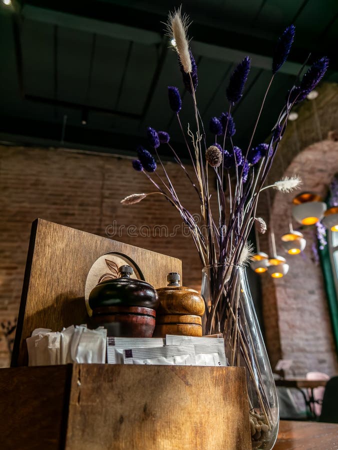 Charming Cafe Table Decor Featuring Dried Flowers, Condiments, and Cozy ...