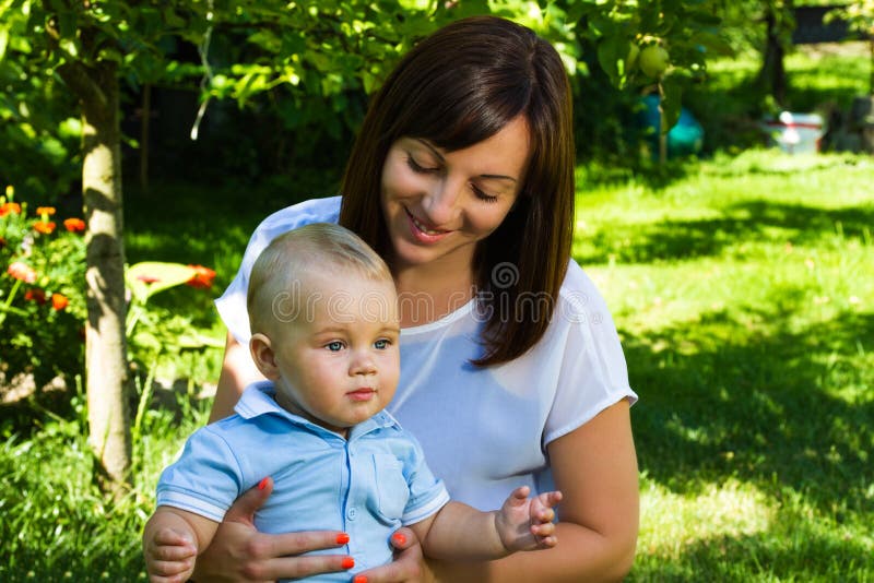 Charming Caucasian Baby Boy with Mother Stock Photo - Image of flower ...