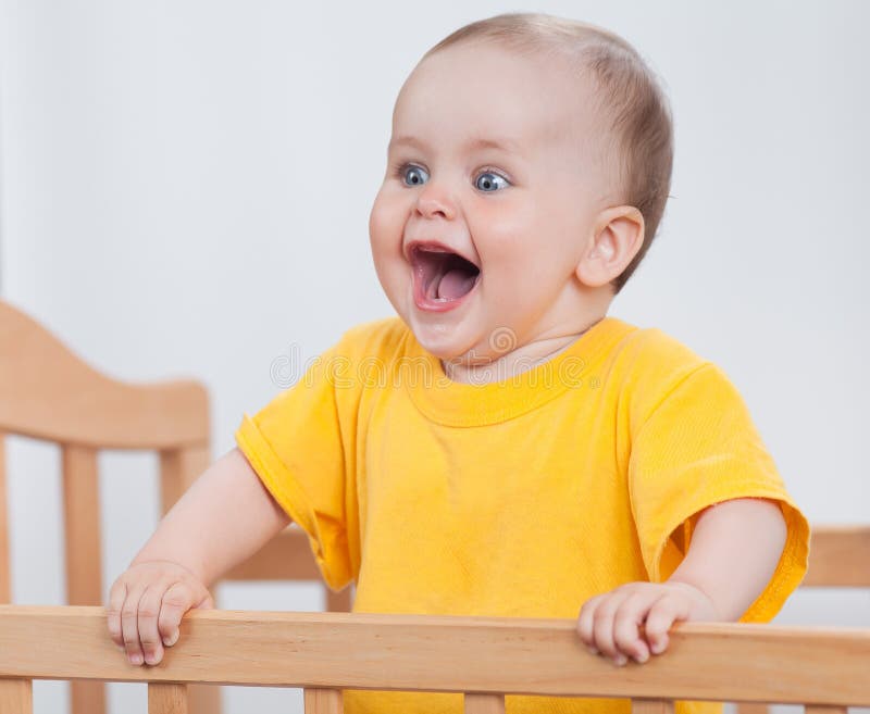 Charming child in the crib stock photo. Image of funny - 29247518