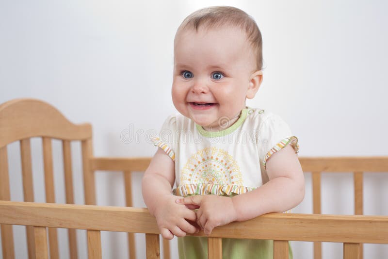 Charming child in the crib stock image. Image of horizontal - 29247855