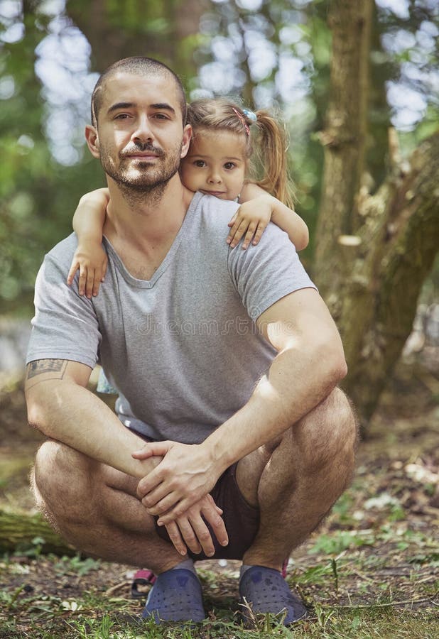 Charming Child Hugging Father in the Yard in Denmark Stock Image ...