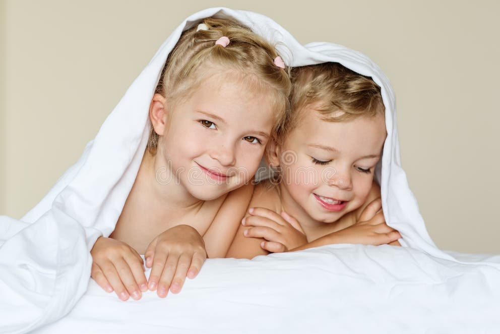 The Charming Children Playing on the Bed Stock Photo - Image of lifestyle, laugh: 103236822