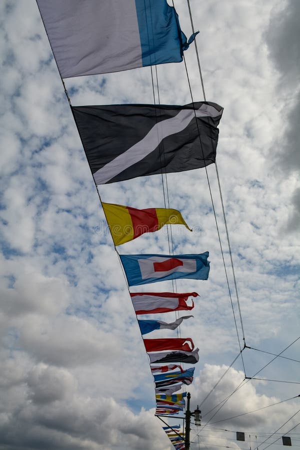 Multi-colored Flags on a Background of Clouds Stock Image - Image of ...