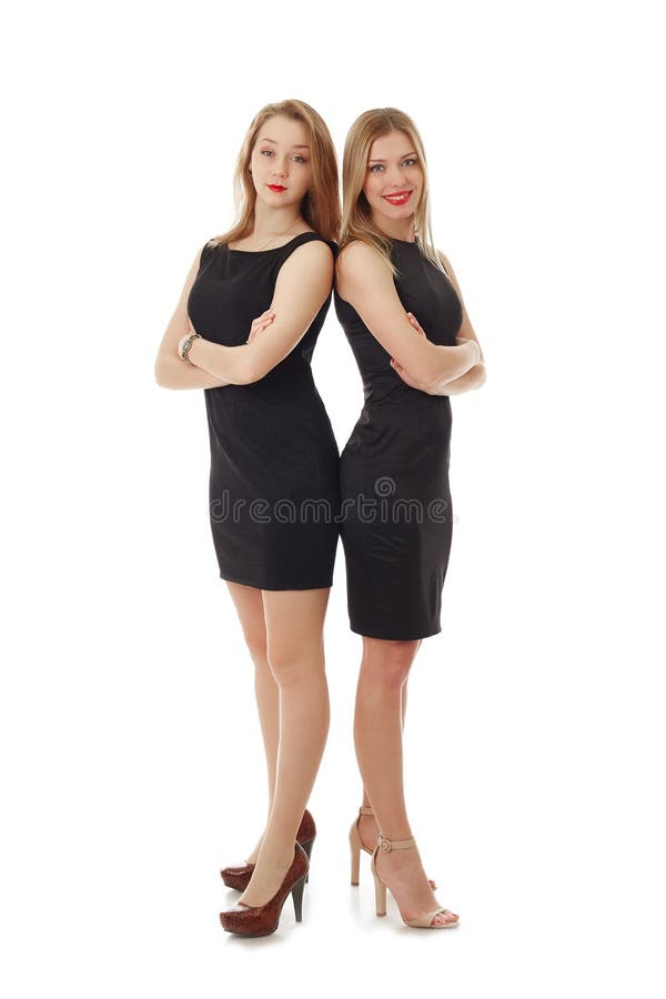Two Trendy Young Women Standing Back To Back Stock Photos - Free ...