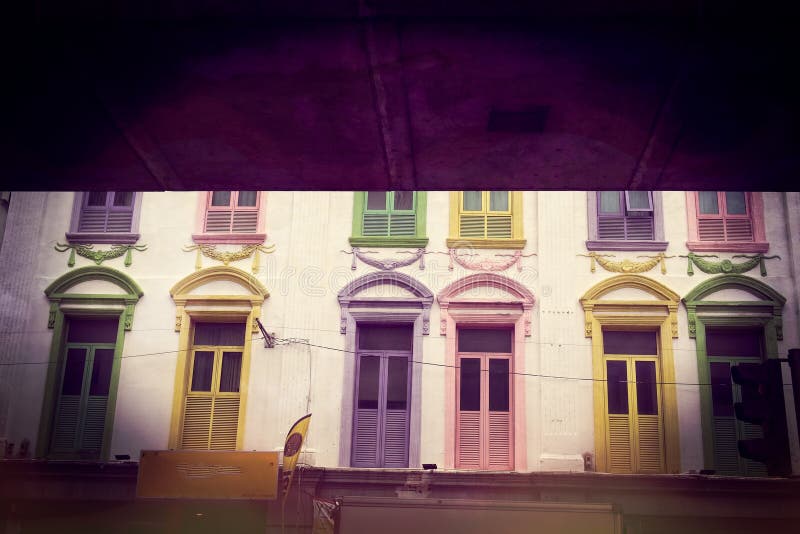 Charming Colorful Building Facade with Pastel Windows Stock Image ...