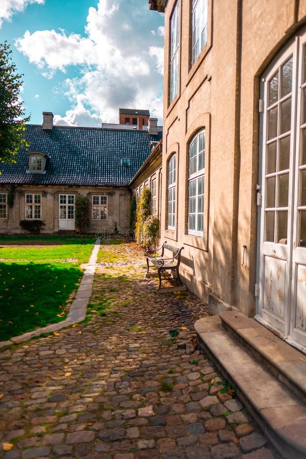 Charming Distinctive Architecture in a Sunlit Cobblestone Courtyard on ...