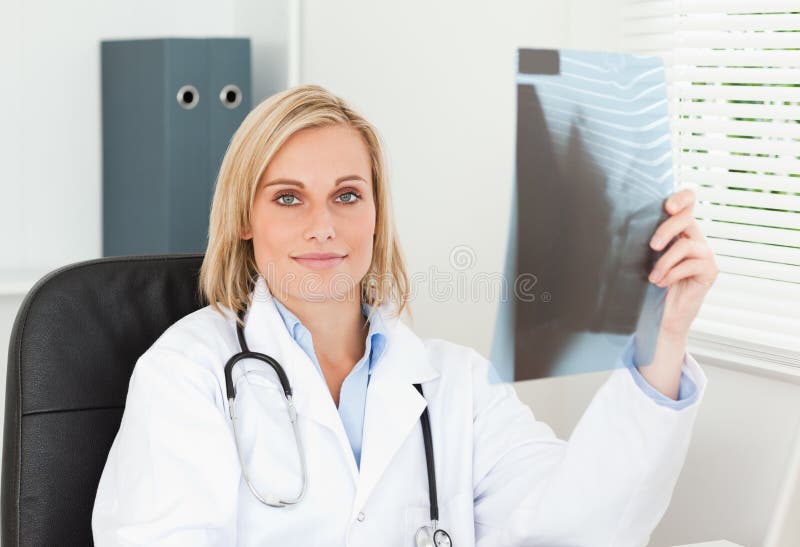 Charming Doctor Holding X-ray Looks into Camera Stock Image - Image of ...