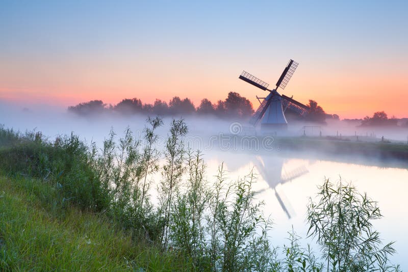 Charming Dutch Windmill by River Stock Photo - Image of outdoors ...