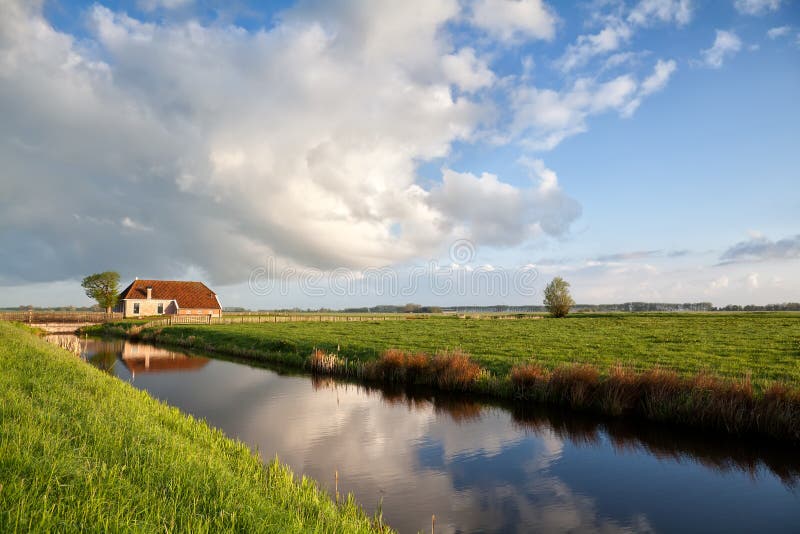 Charming Farmhouse, River and Blue Sky Stock Photo - Image of people ...