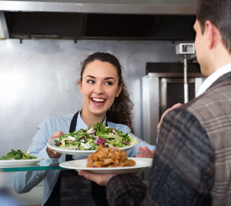 Charming Female Worker Serving Customer with Smile Stock Photo - Image ...