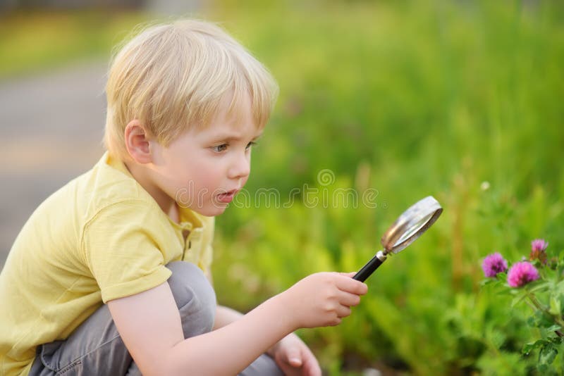 Charming Kid Exploring Nature with Magnifying Glass Stock Photo - Image ... Charming Kid Exploring Nature with Magnifying Glass Stock Photo - Image ...
