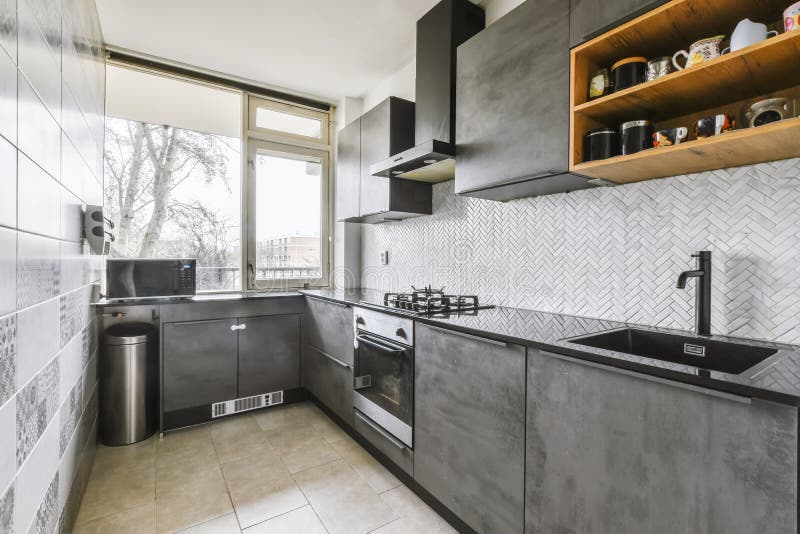 Charming Kitchen Area with a Black Kitchen Set Stock Image - Image of ...