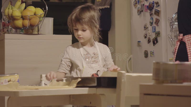 Charming Little Girl Making Biscuits at the Kitchen Table Stock Video - Video of kitchen, little ...