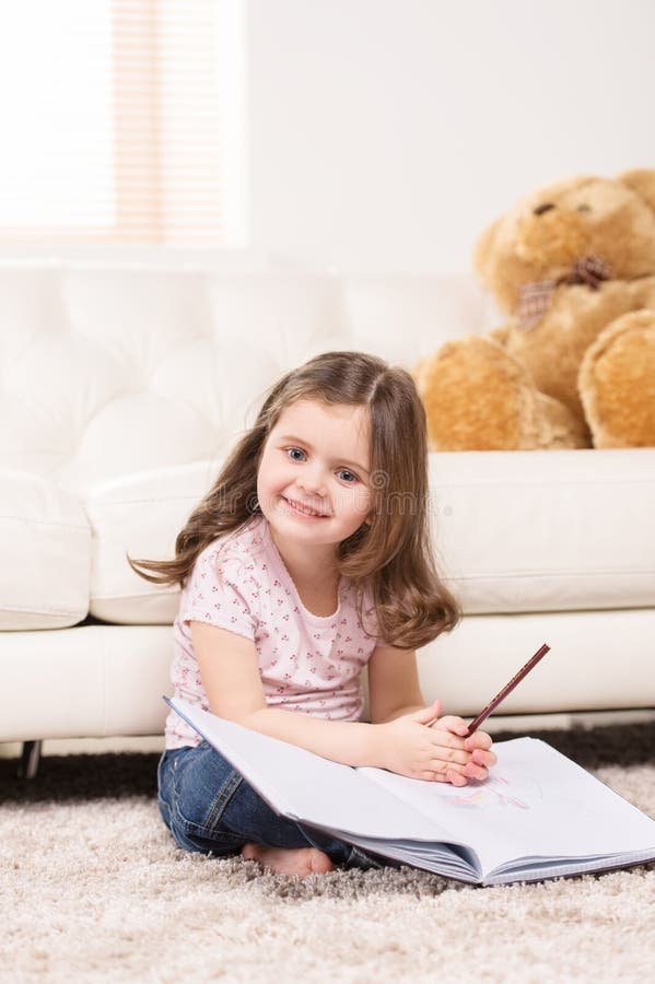 Charming Little Girl Writing in Notebook. Stock Image - Image of ...